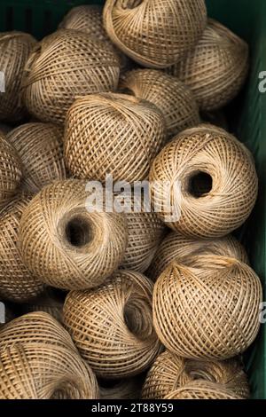 Plenty of spools or rolls of brown color linen string Stock Photo - Alamy