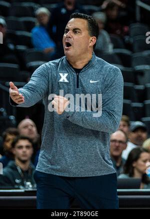 Xavier head coach Sean Miller, right, speaks with an official during ...