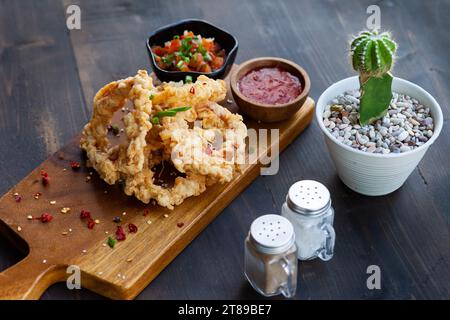 Large onion rings Mexican-style with salsa and sauce Stock Photo - Alamy