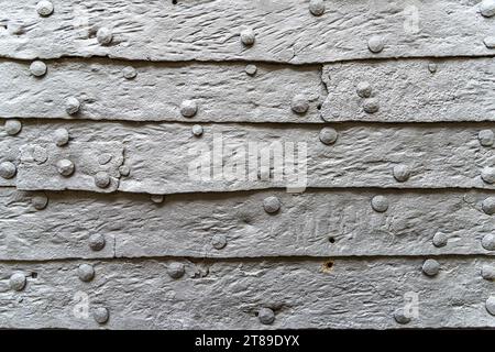 Wrought iron sheet surface with metal rivets Stock Photo - Alamy