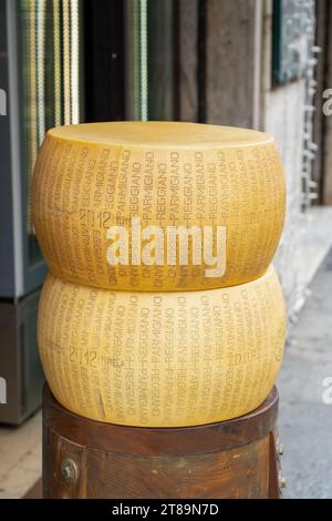 Parmesan cheese wheels on display in a fridge, Italian food store ...
