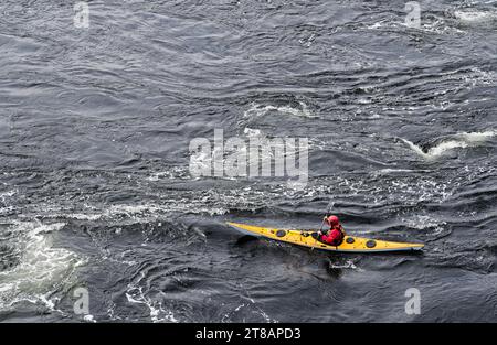 Canoe on fast flowing sea water at Oban in Scotland Stock Photo - Alamy