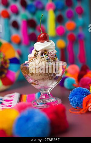 Pom pom colorful party garland on blue backgrouns Stock Photo - Alamy
