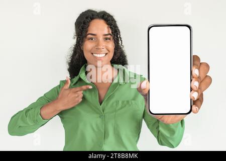 A finger points at a touchscreen display in an interactive room, museum ...