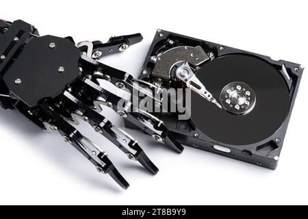 Real robotic hand with Hard disk drive. Concepts of AI-powered data ...