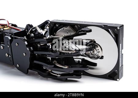 Real robotic hand with Hard disk drive. Concepts of AI-powered data ...