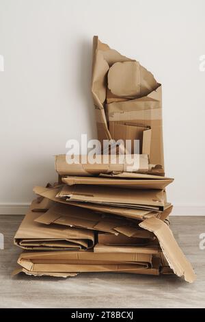 Stack of Cardboard Waste at home. Concepts of Paper Recycling and Waste ...