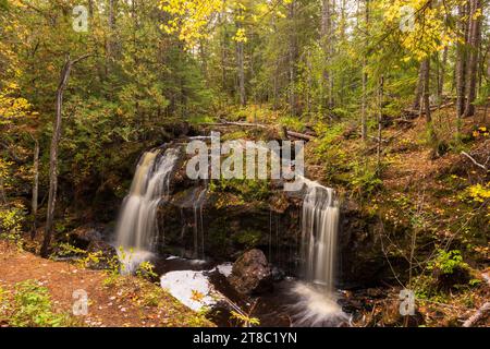 A split waterfall on a creek in the woods during autumn Stock Photo - Alamy