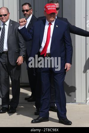 President Donald Trump pumps his fist as he departs after speaking at a ...