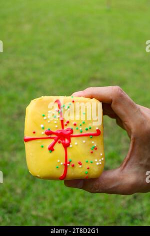 Gift box on the green lawn for Christmas, new year, valentine day or ...