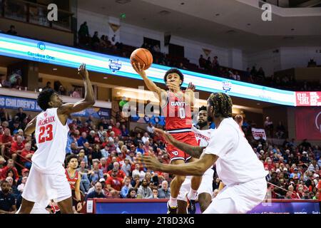 Dayton guard Javon Bennett (0) shoots against Cincinnati forward Aziz ...