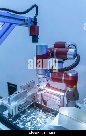 robot drill machine tool with camera at industrial manufacture factory ...