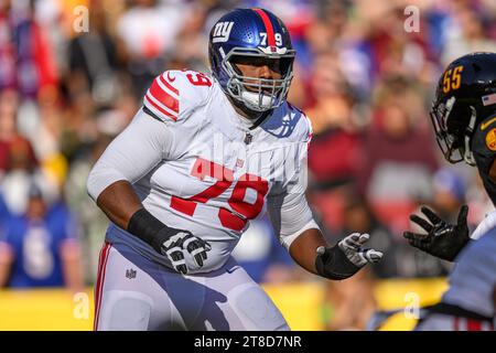 Washington Commanders offensive tackle Tyre Phillips (62) steps on the ...