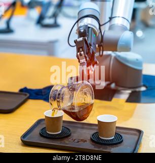automatic robot arm preparing coffee with coffee machine Stock Photo ...