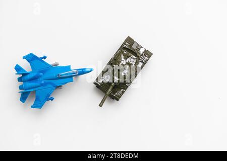 The image shows models of tanks and fighter jets on a white background ...
