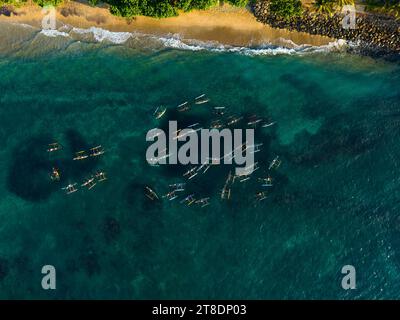 Aerial view of traditional oruwa boats with fishermen in tropical ...