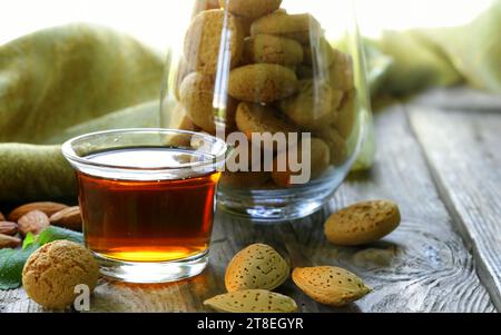 amaretto almond liqueur with fresh nuts Stock Photo - Alamy