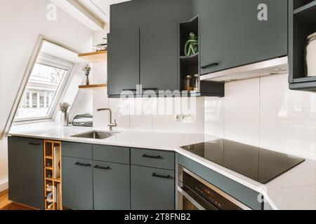 Interior of modern kitchen with grey counter, oven and food Stock Photo ...