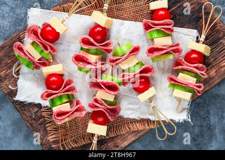 Mini Greek deli kebabs with salami, cheese, cherry tomatos and cucumber ...