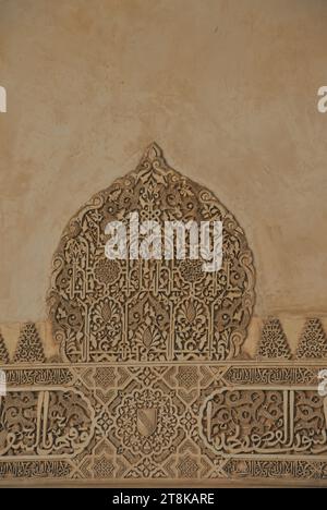 The walls of the Alhambra Palace are adorned with beautiful Arabic ...