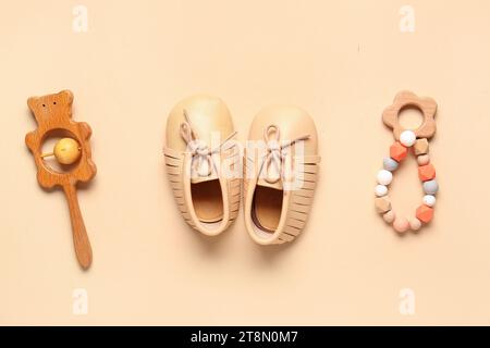 Stylish baby shoes with rattles on turquoise background Stock Photo - Alamy