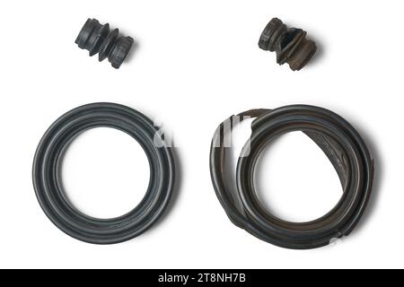 close-up of damaged brake caliper pin and piston boots with seal, worn ...