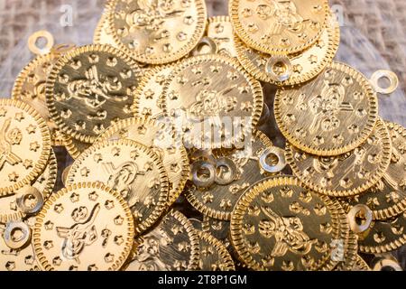 Plenty of fake gold coins are on canvas Stock Photo - Alamy