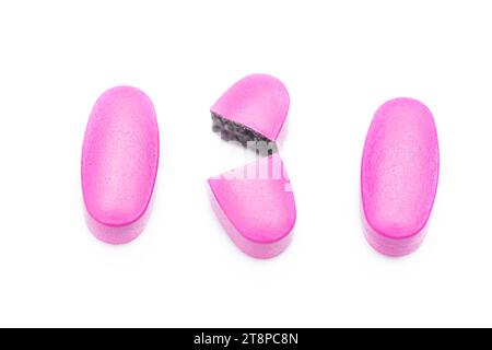 Broken pill isolated over a white background. Healthcare and medicine ...