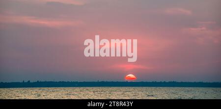 Beautiful red and orang sunset over the lake Stock Photo - Alamy