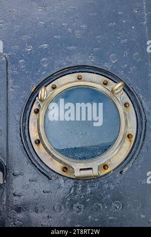 Closeup of round small porthole window on the side of vessel Stock ...