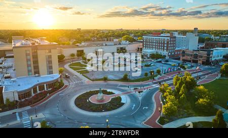 Passing of the Buffalo Native American statue with golden sun beside it ...