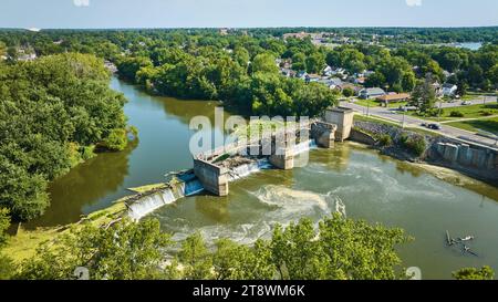 Maumee River Dam swirling water with waterfalls chocked by tree logs ...