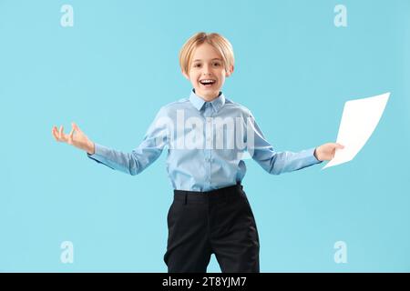 Little actor with film script on beige background Stock Photo - Alamy