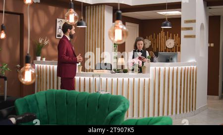 Businessman gives passport during check in and offers id credentials to ...