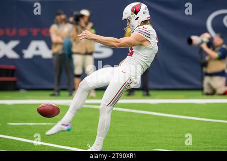 Arizona Cardinals punter Blake Gillikin, left, long snapper Aaron ...