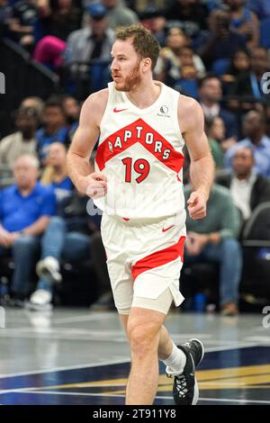 Toronto Raptors' Jakob Poeltl, center right, shoots the ball against ...