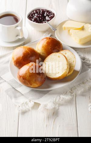 Fresh rolls for breakfast. Bun with butter to a cup of coffee in Stock ...