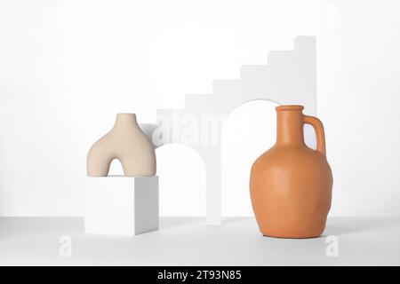Clay flagon and decorative elements on white background Stock Photo - Alamy