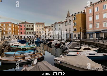 Muggia, Italy – November 18, 2023. Panoramic shot of the old harbour of ...