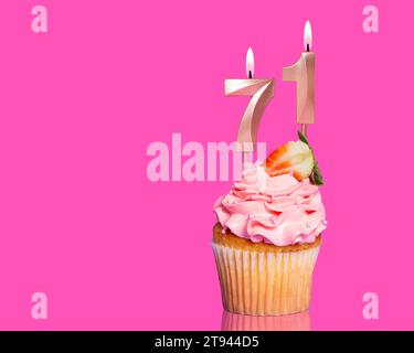 Pink number 71 birthday candle on white background Stock Photo - Alamy