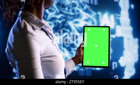 Admin in data center with chroma key tablet using artificial intelligence computing simulating ...