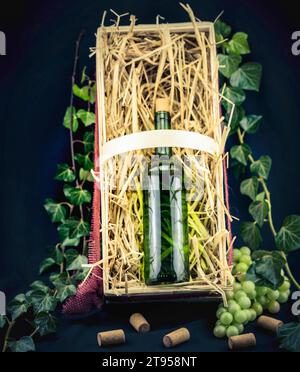 Green wine bottles in the box on the white table Stock Photo - Alamy