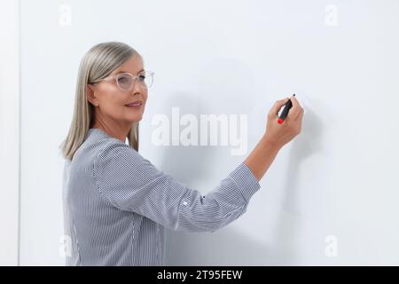 Portrait of professor explaining something at whiteboard Stock Photo ...