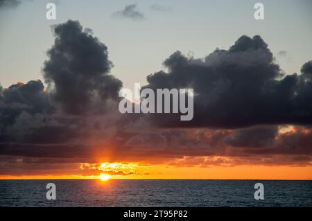 Tropical sunset at sea, off the Solomon Islands in the South Pacific ...