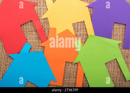 Little house shape cut out of paper on a canvas background Stock Photo ...