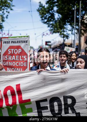 A student is seen walking into a primary school in Logan City, Brisbane ...