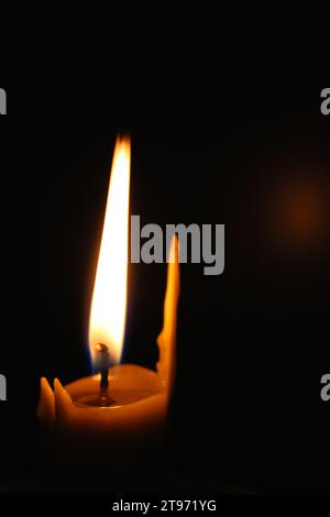 Sorrow concept. Red candle in iron lantern at the cemetery, funeral ...