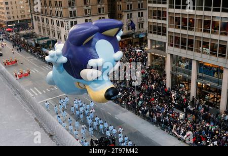 The Bluey balloon floats down Sixth Avenue during the Macy's ...