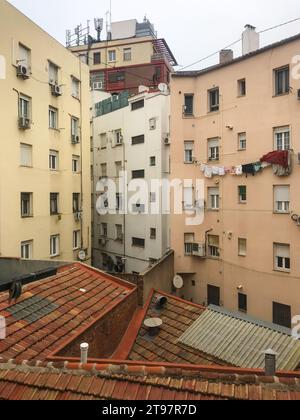 Laundry hanging from a thread in the window of a building in a district ...