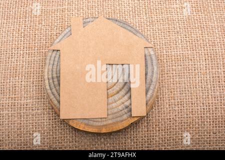Little paper house placed on a linen canvas Stock Photo - Alamy